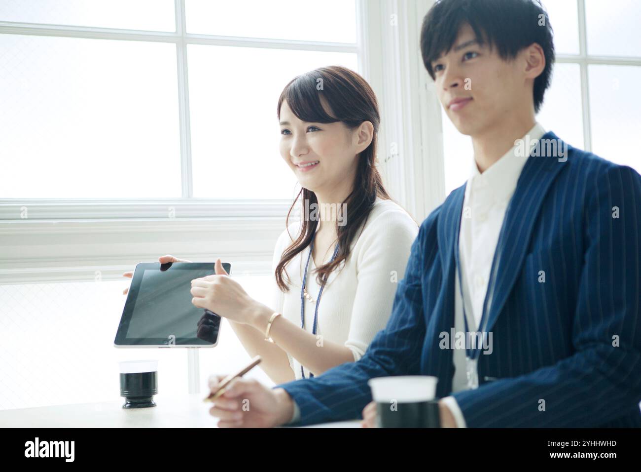 Man and woman giving a presentation Stock Photo - Alamy