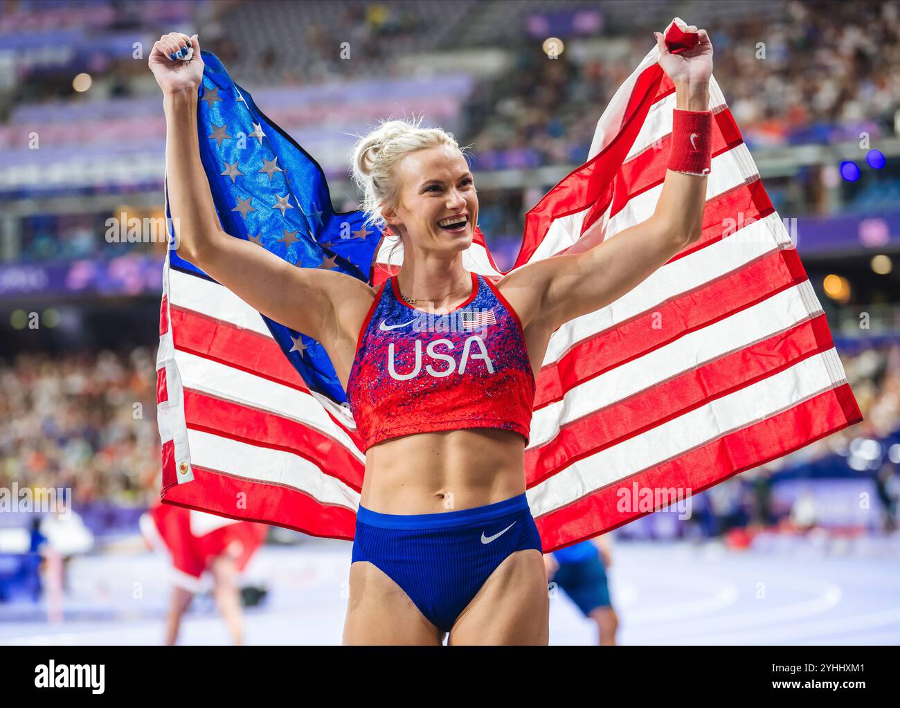 Katie Moon celebrating her victory with her country's flag at the Paris ...