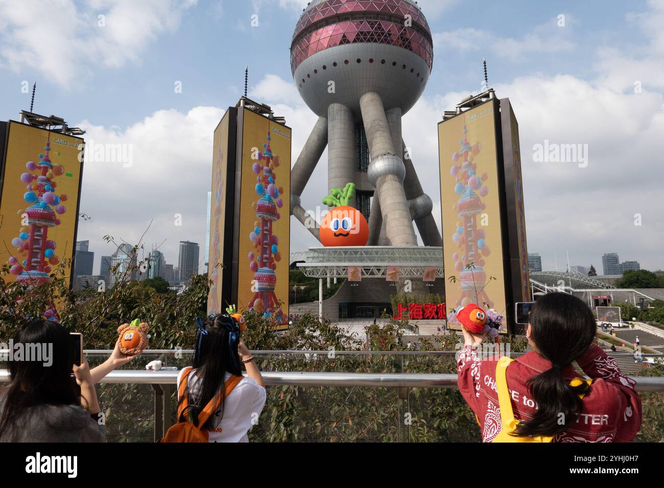 A giant mojo carrot is seen under the Oriental Pearl Tower in Shanghai ...