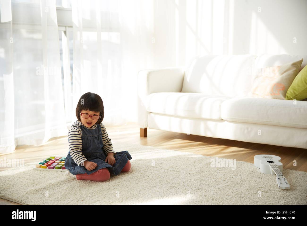 Sit on the carpet hi-res stock photography and images - Alamy