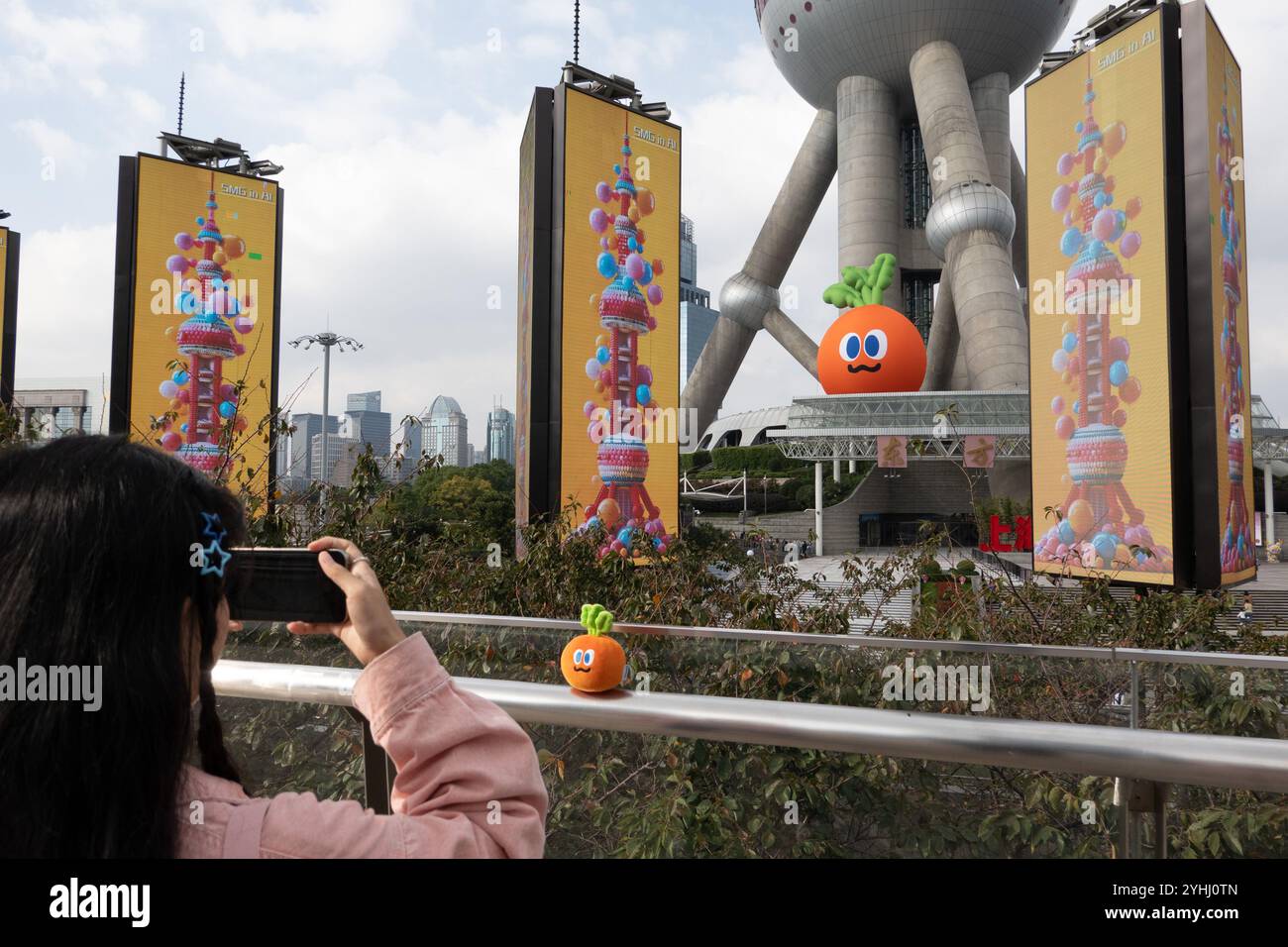 A giant mojo carrot is seen under the Oriental Pearl Tower in Shanghai ...