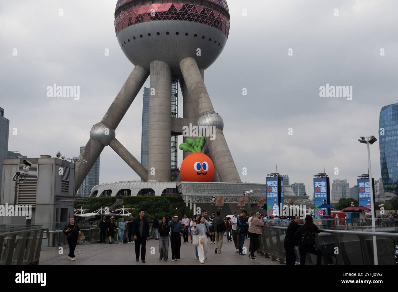 A giant mojo carrot is seen under the Oriental Pearl Tower in Shanghai ...
