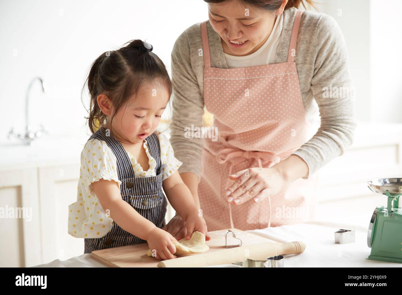 Girl cooking with her sister Stock Photo - Alamy