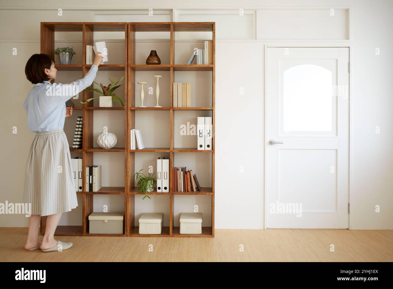 Putting box on shelf hi-res stock photography and images - Alamy