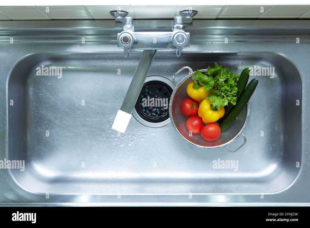 Washing vegetables in sink Stock Photo - Alamy