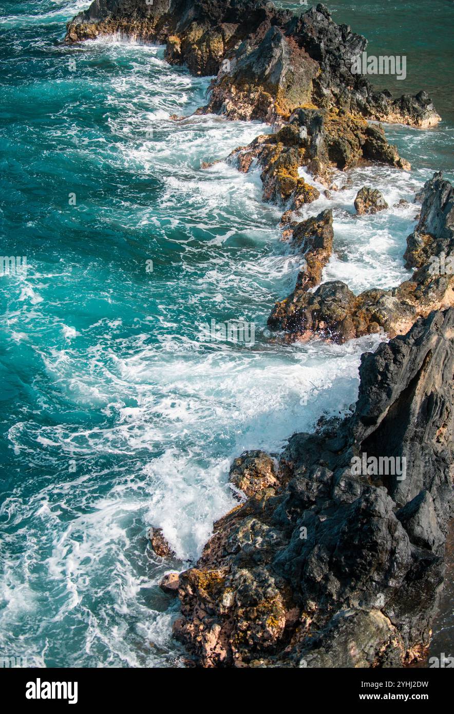 Rock and sea. View of turuoise water and lava rocks beach, atlantic ...