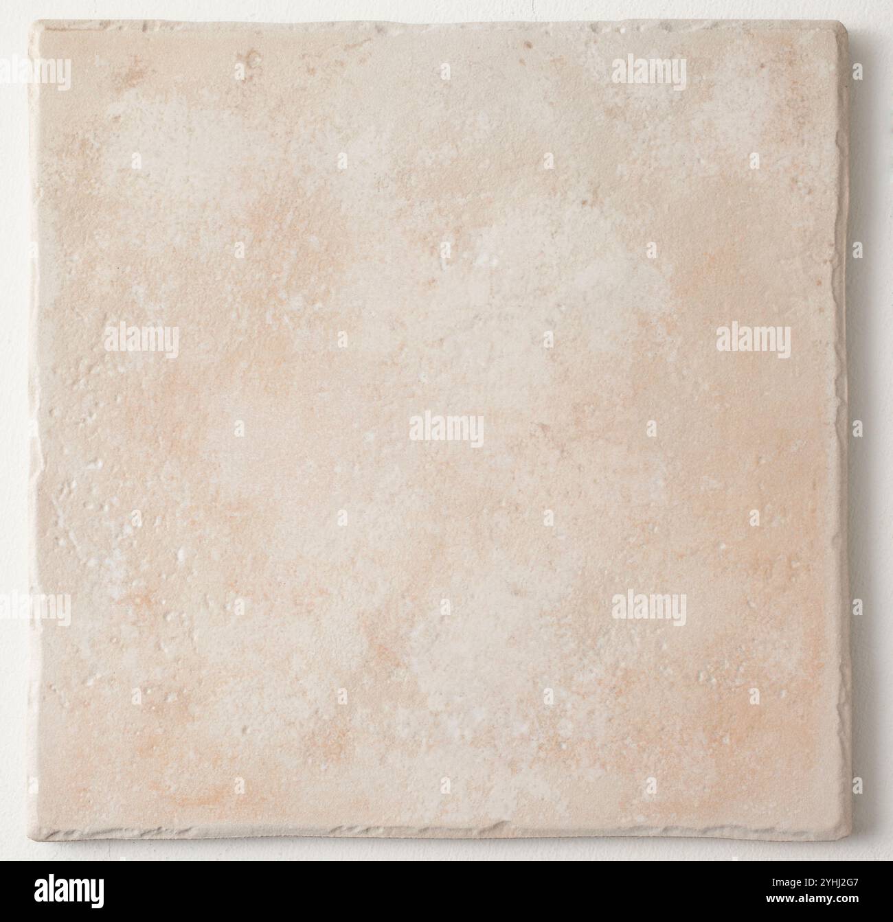 Four-sided scraped beige stone tiles Stock Photo - Alamy