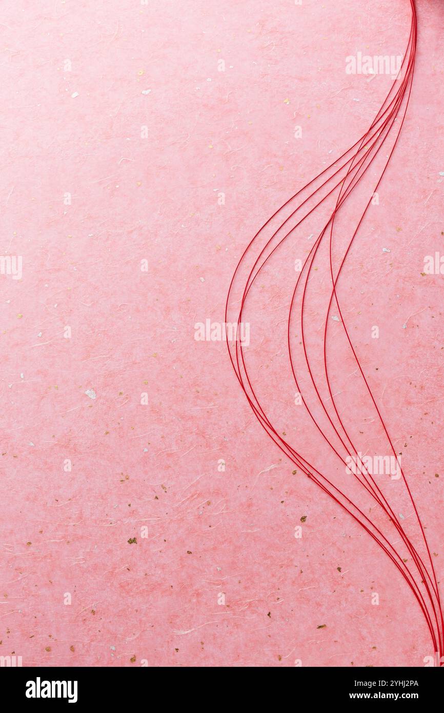 Peach-coloured Japanese paper and red mizuhiki Stock Photo - Alamy