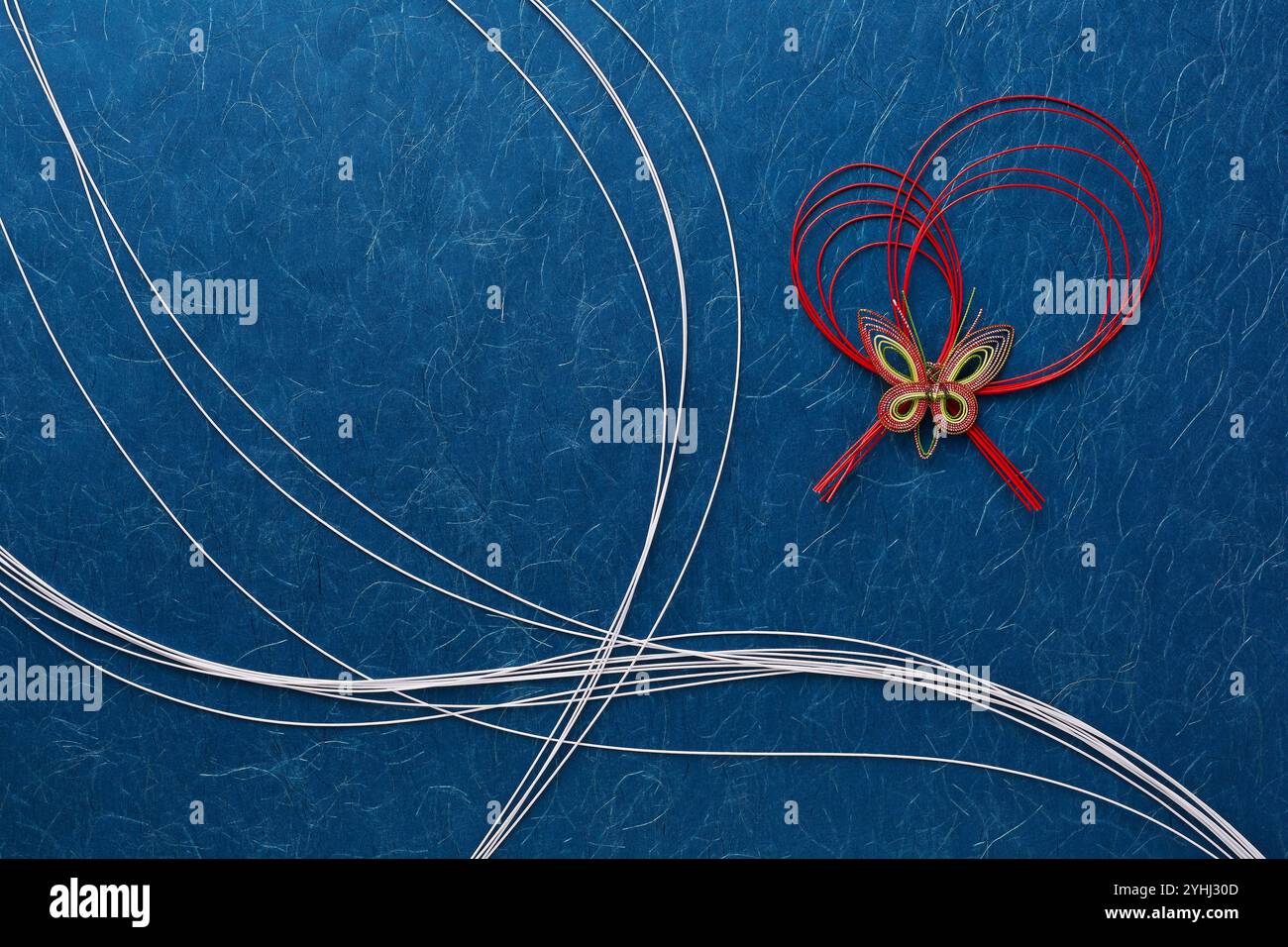 Dark blue Japanese paper, white mizuhiki and decoration Stock Photo - Alamy