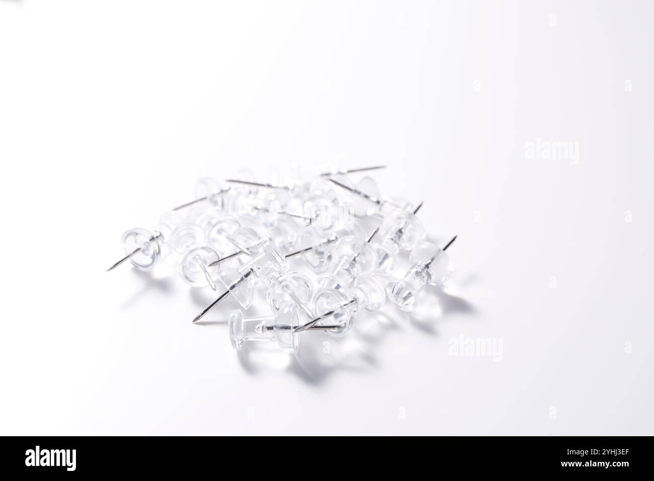 Rolled transparent push pin Stock Photo - Alamy