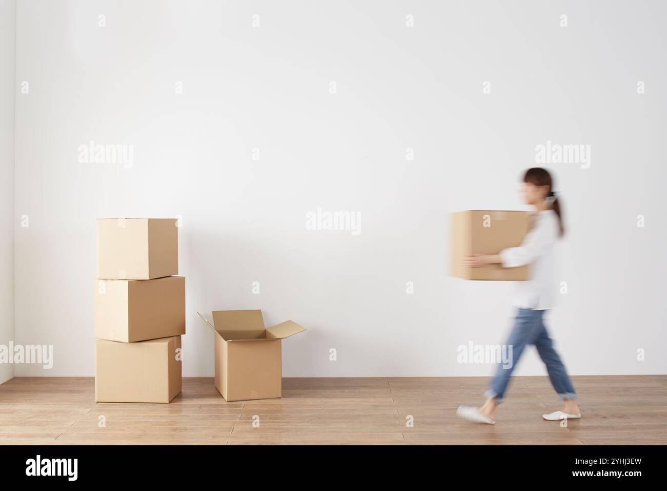 Woman carrying stack of cardboard boxes hi-res stock photography and ...