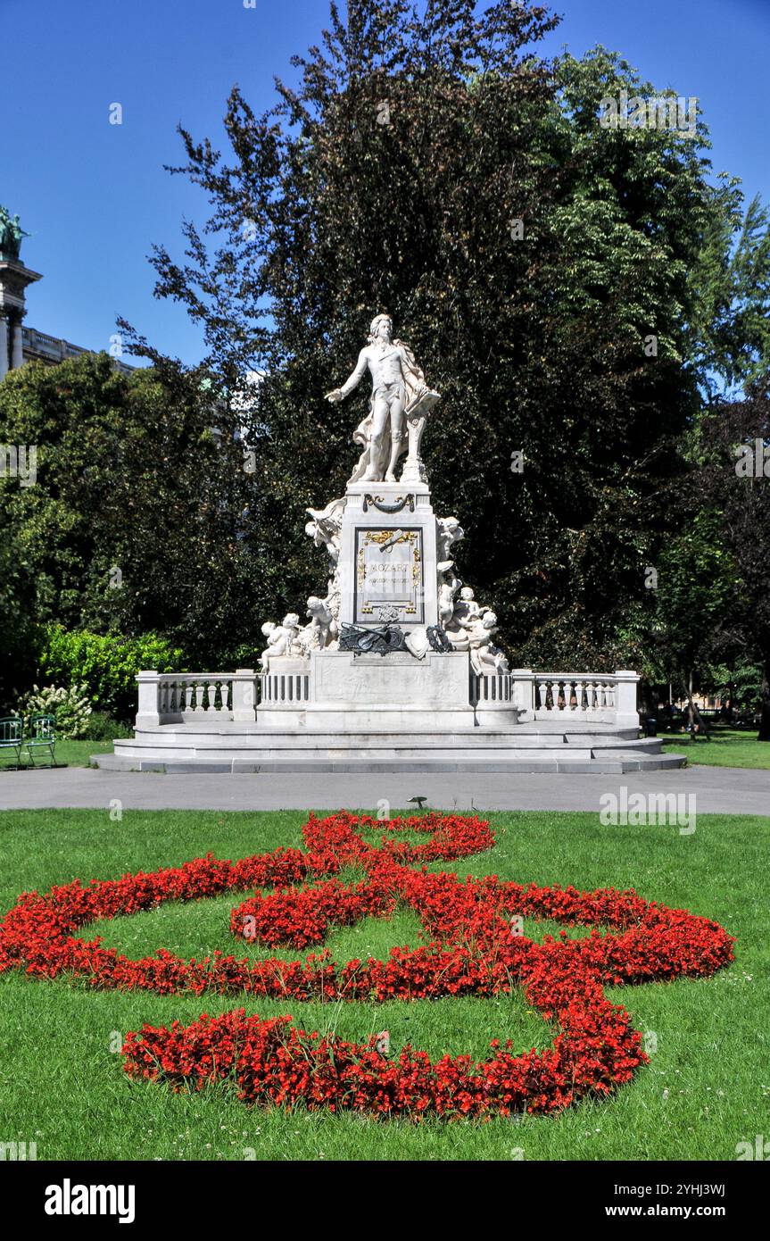 Mozart statue in Burggarten castle garden and a floral treble clef in ...