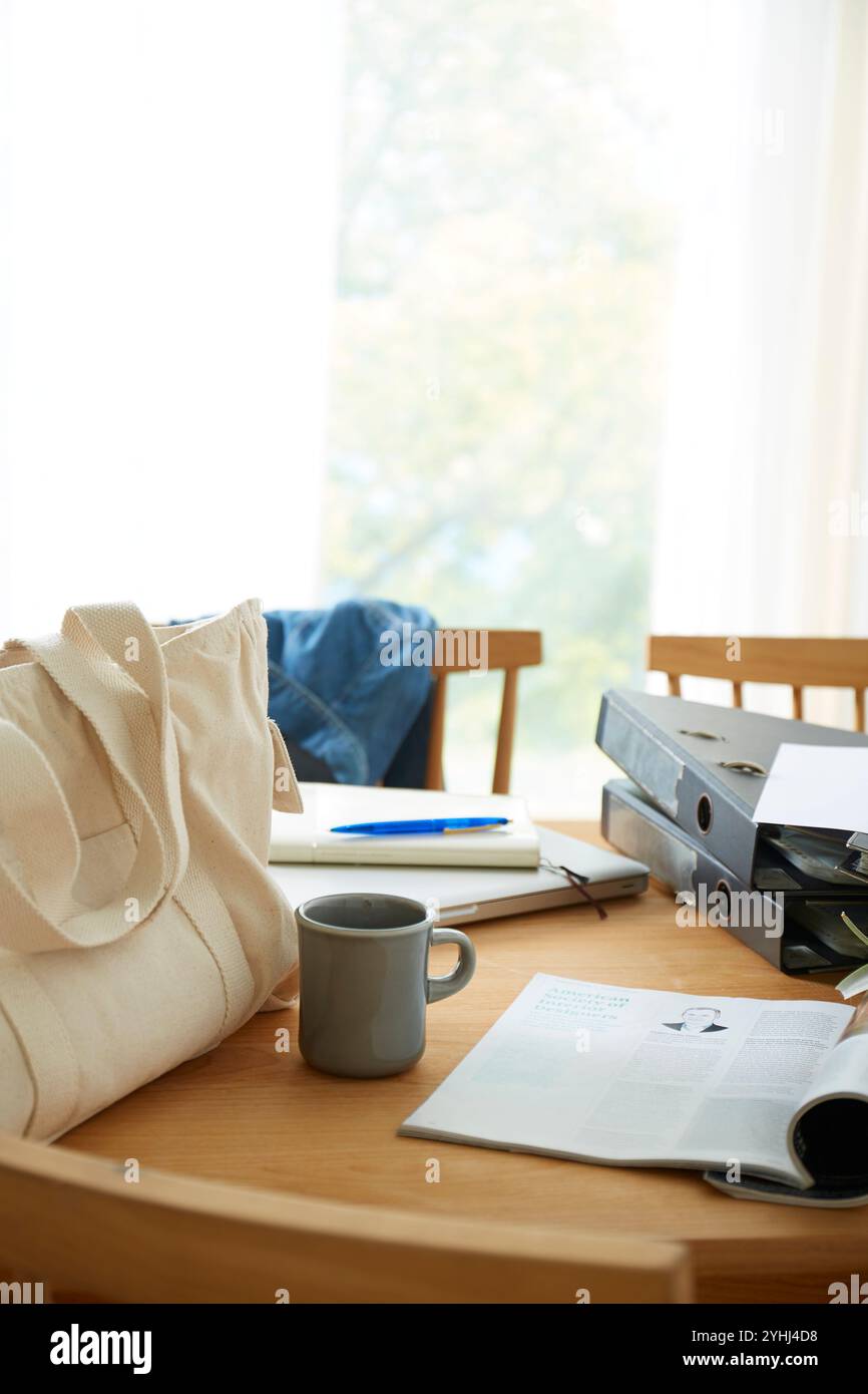 Bags and coffee cups on the dining table Stock Photo - Alamy