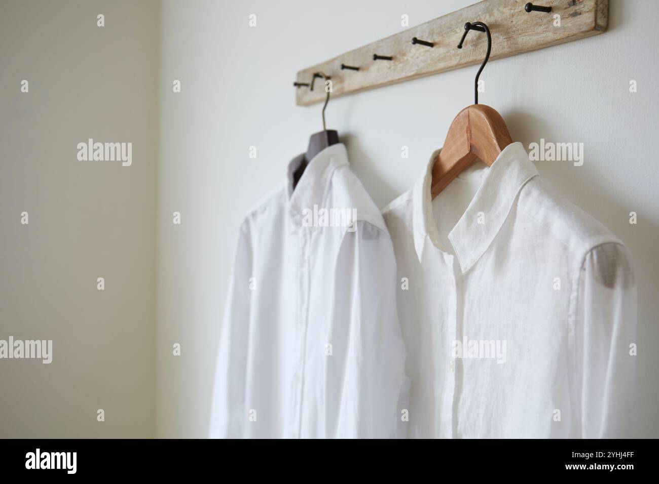 Two shirts on the wall Stock Photo - Alamy