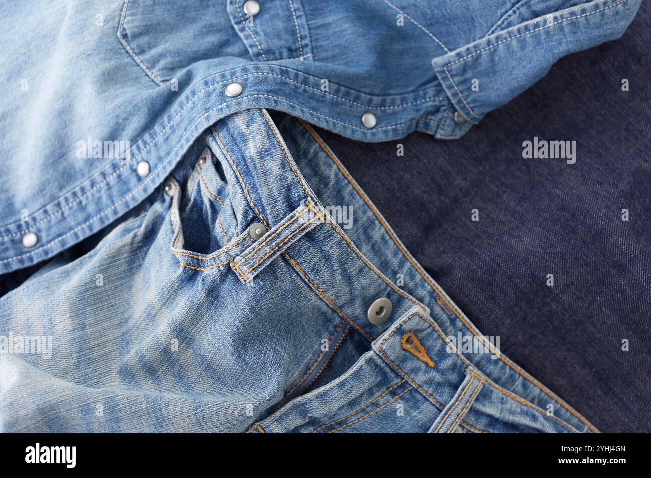 Overlapping denim fabric clothes Stock Photo - Alamy