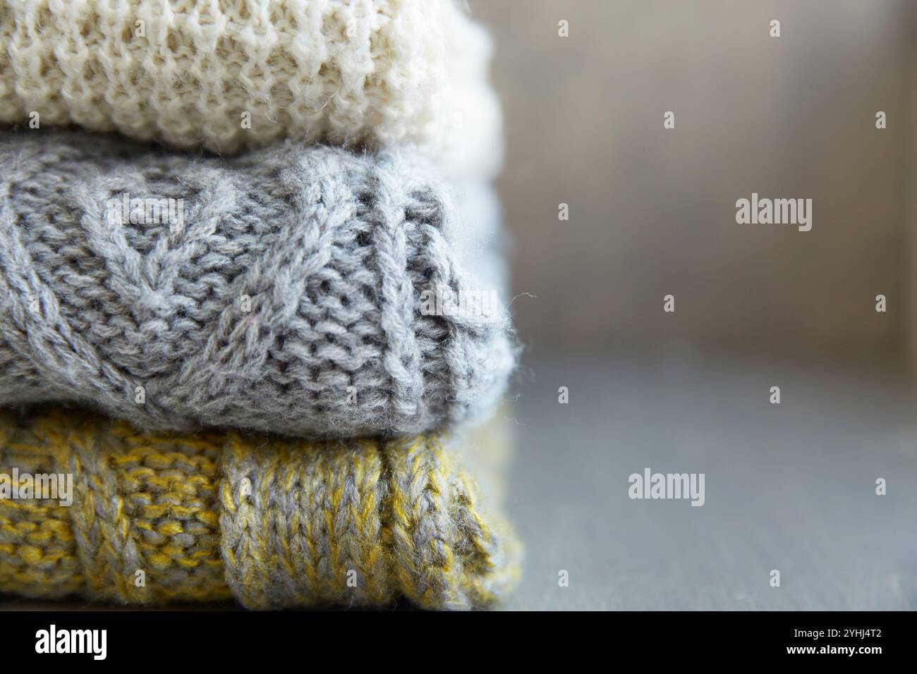 Pile of winter jumpers hi-res stock photography and images - Alamy