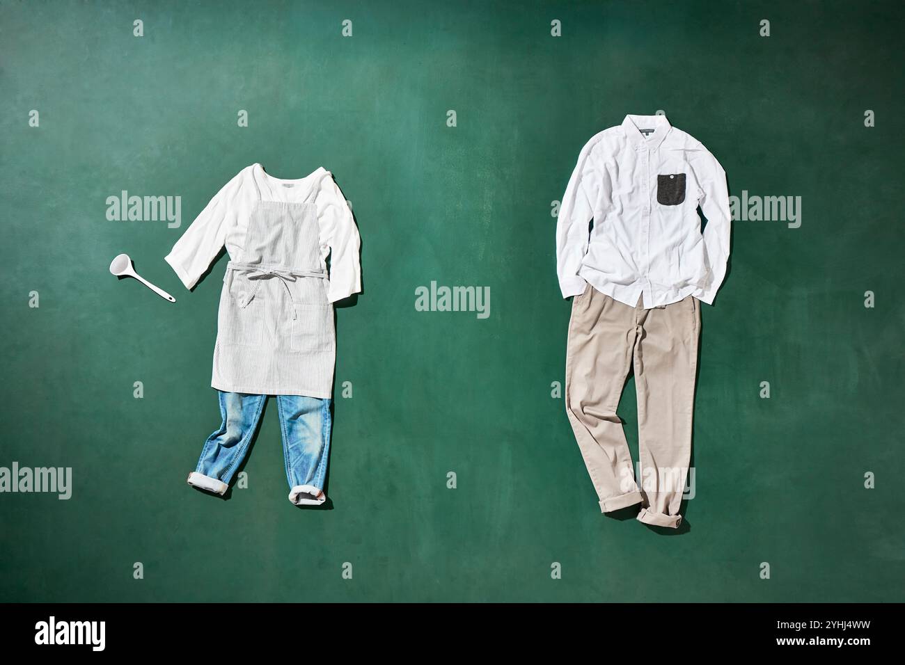 Overhead view of male and female clothing placed on the blackboard ...