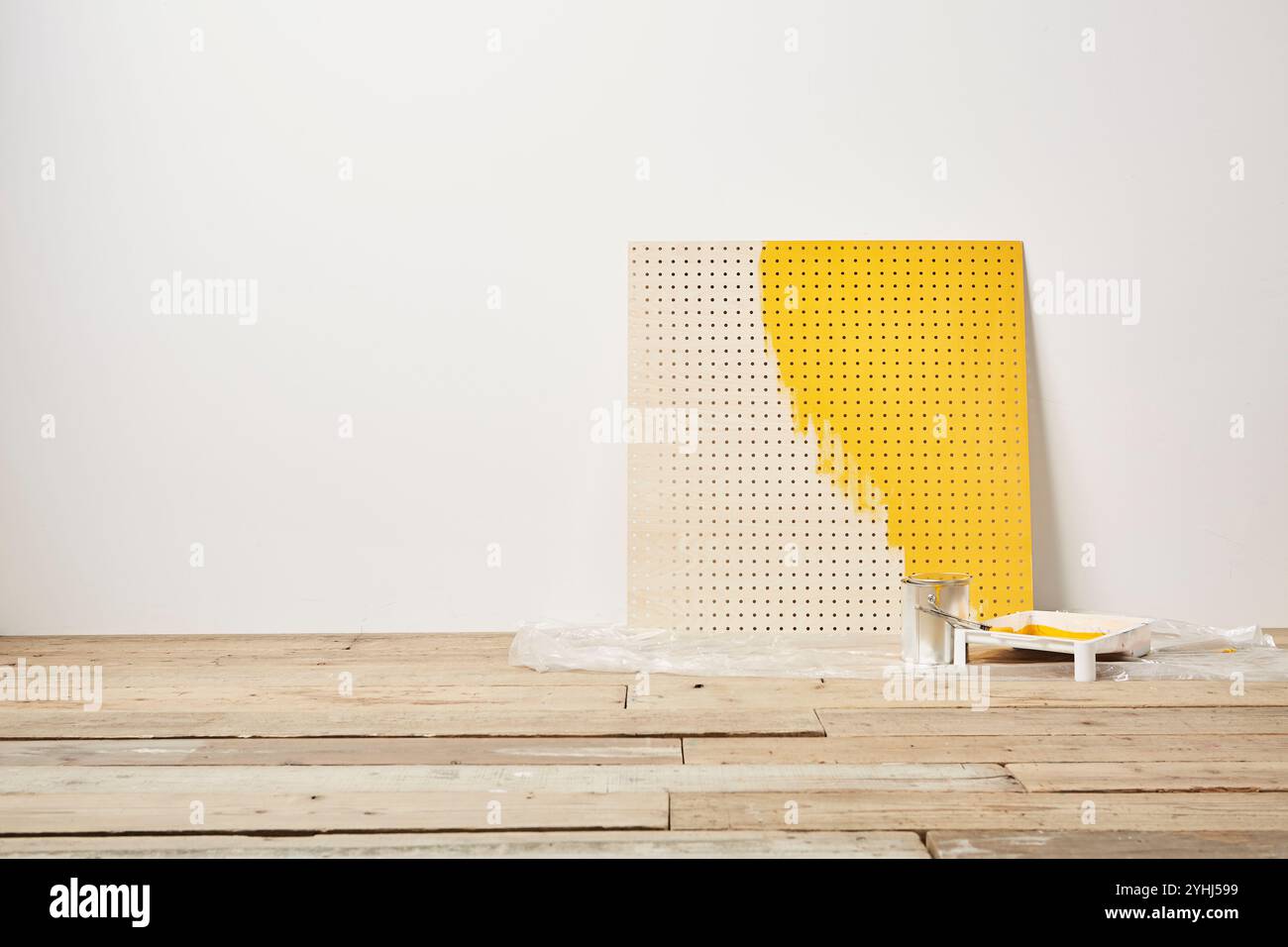 Perforated panel painted yellow Stock Photo - Alamy