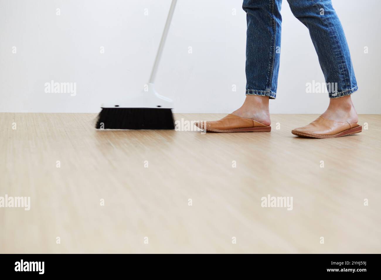 Woman sweeping slippers hi-res stock photography and images - Alamy
