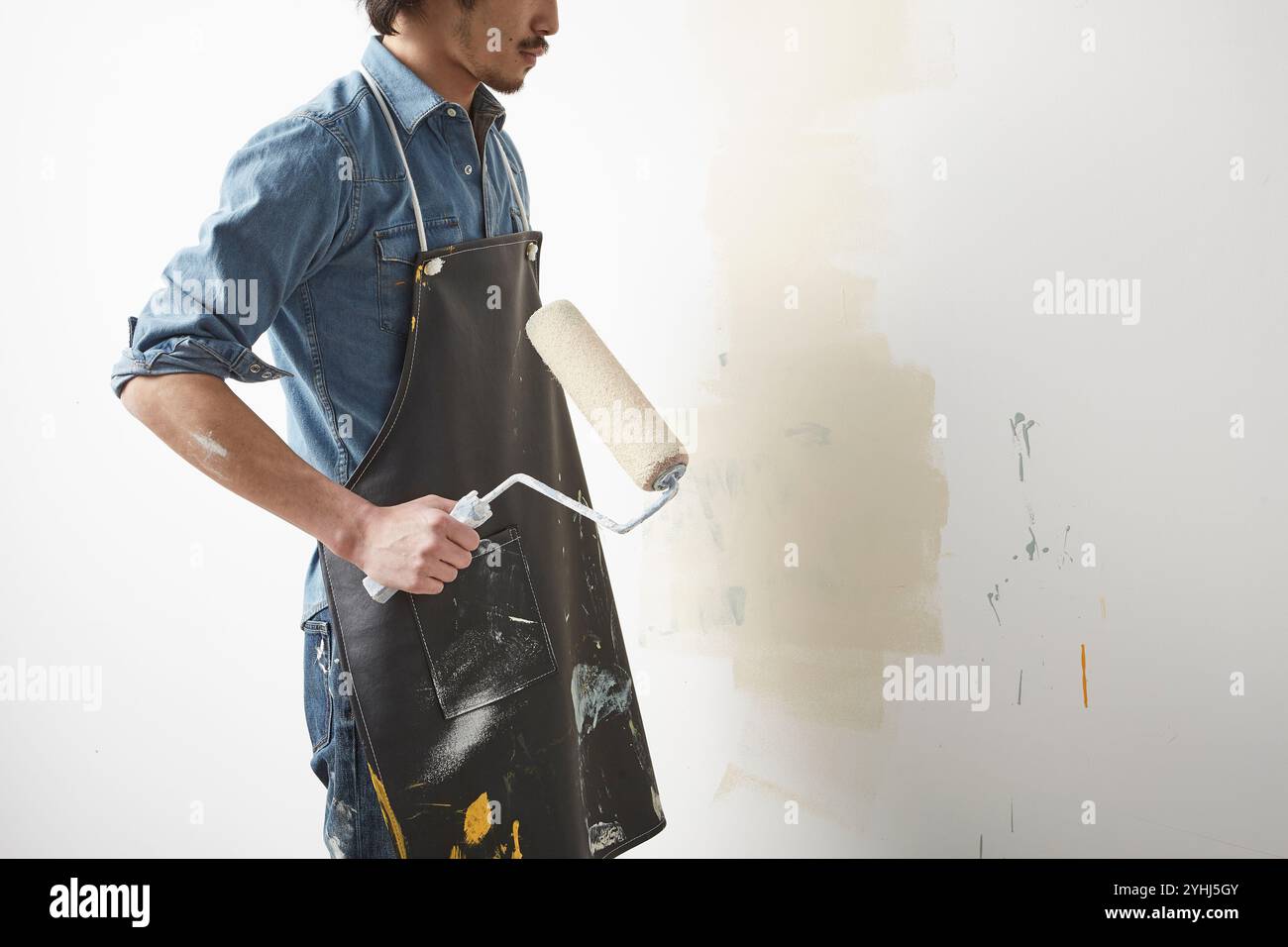 Man using roller Stock Photo - Alamy