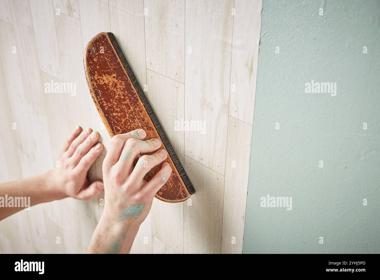 Applying wallpaper to wall hi-res stock photography and images - Alamy