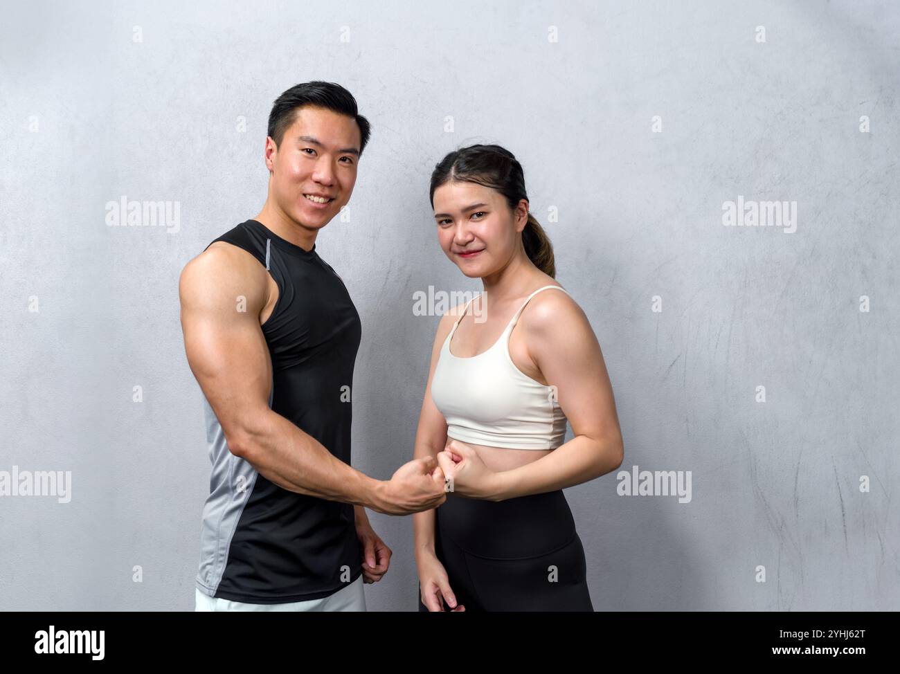 Active Asian couple showcasing their fitness goals with a captivating ...