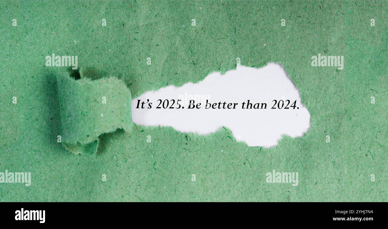 Its 2025. Be Better than 2024 message written on ripped torn paper ...