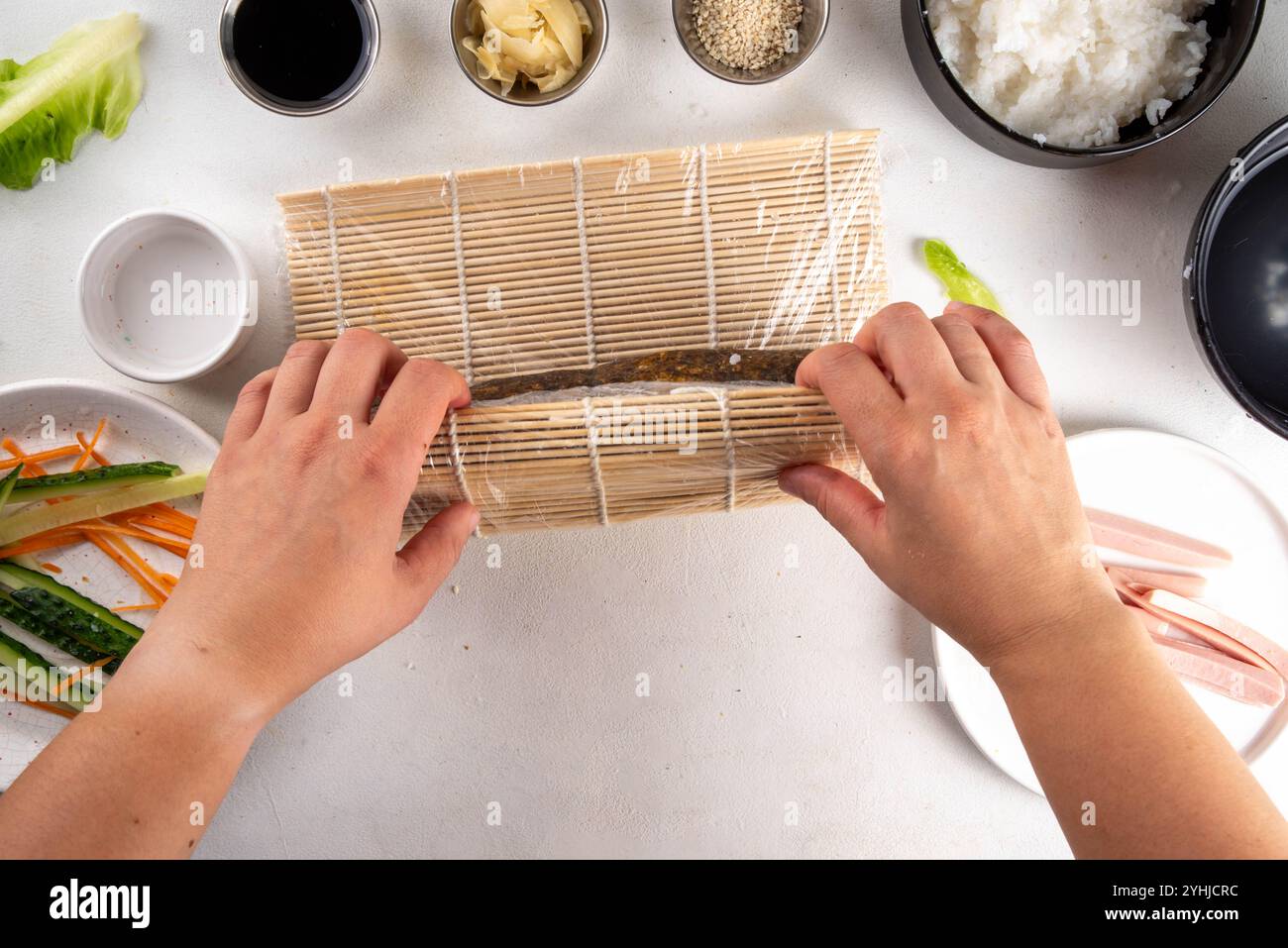 Traditional Korean food kimbap, with ham, vegetables and lettuce ...