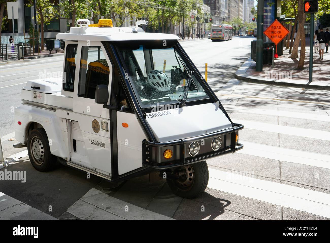 Works 3 wheel vehicle on the street Stock Photo - Alamy