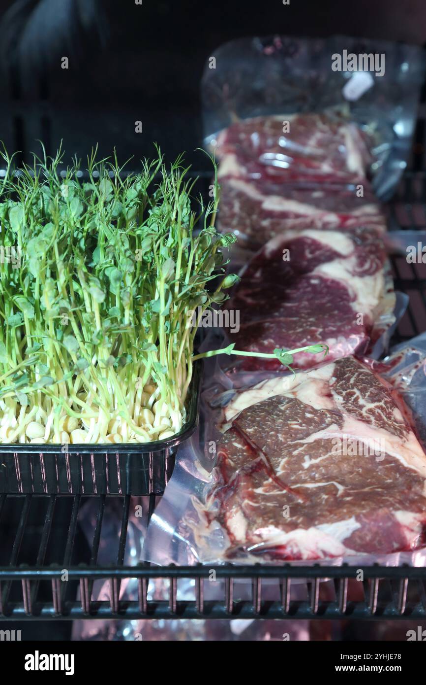 Beef steaks are kept in a special refrigerator before being cooked ...