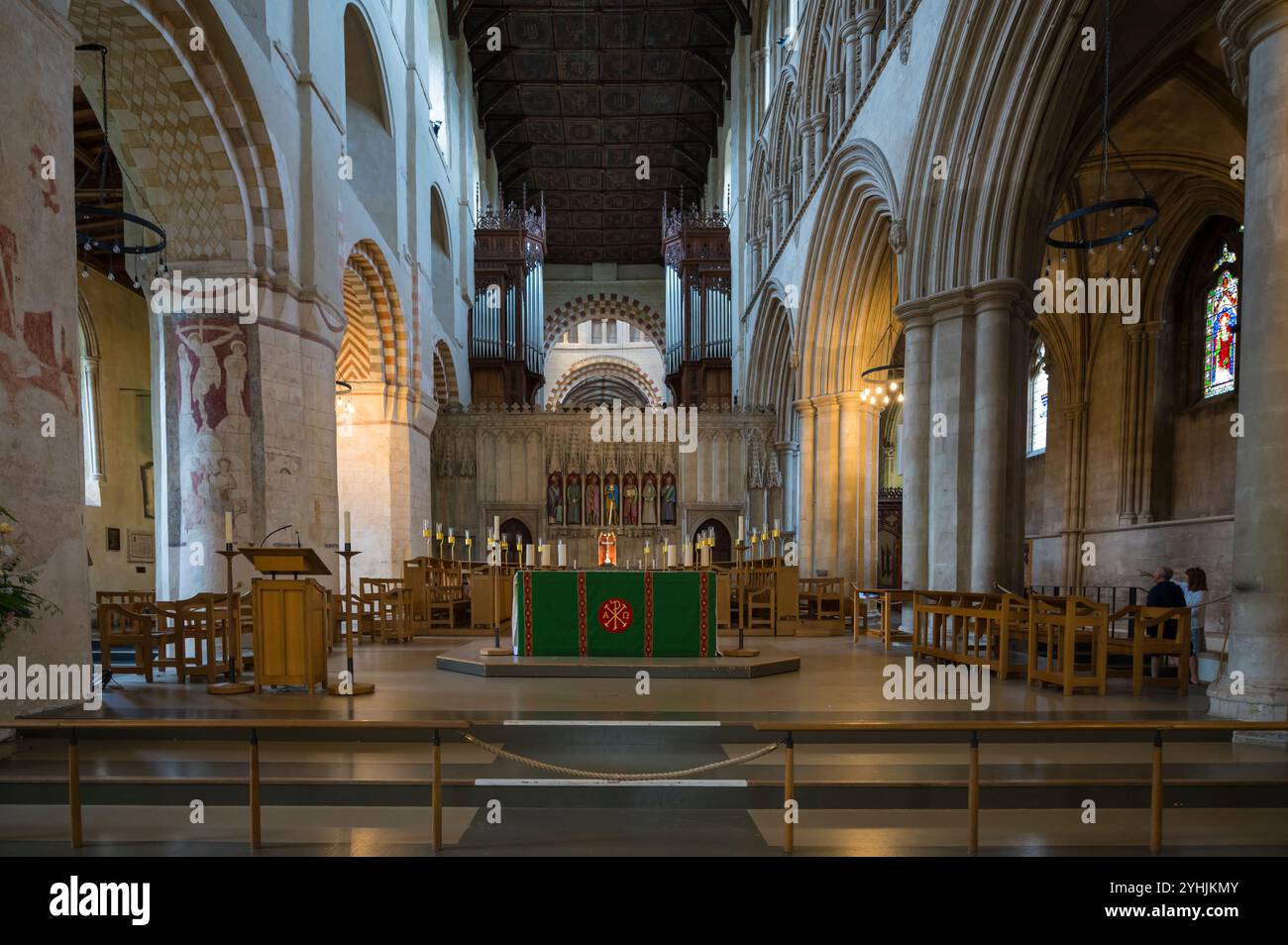 Al;tar and medieval nave screen with sculptures depicting the martyrs ...