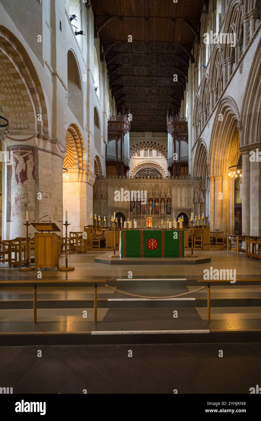 Al;tar and medieval nave screen with sculptures depicting the martyrs ...