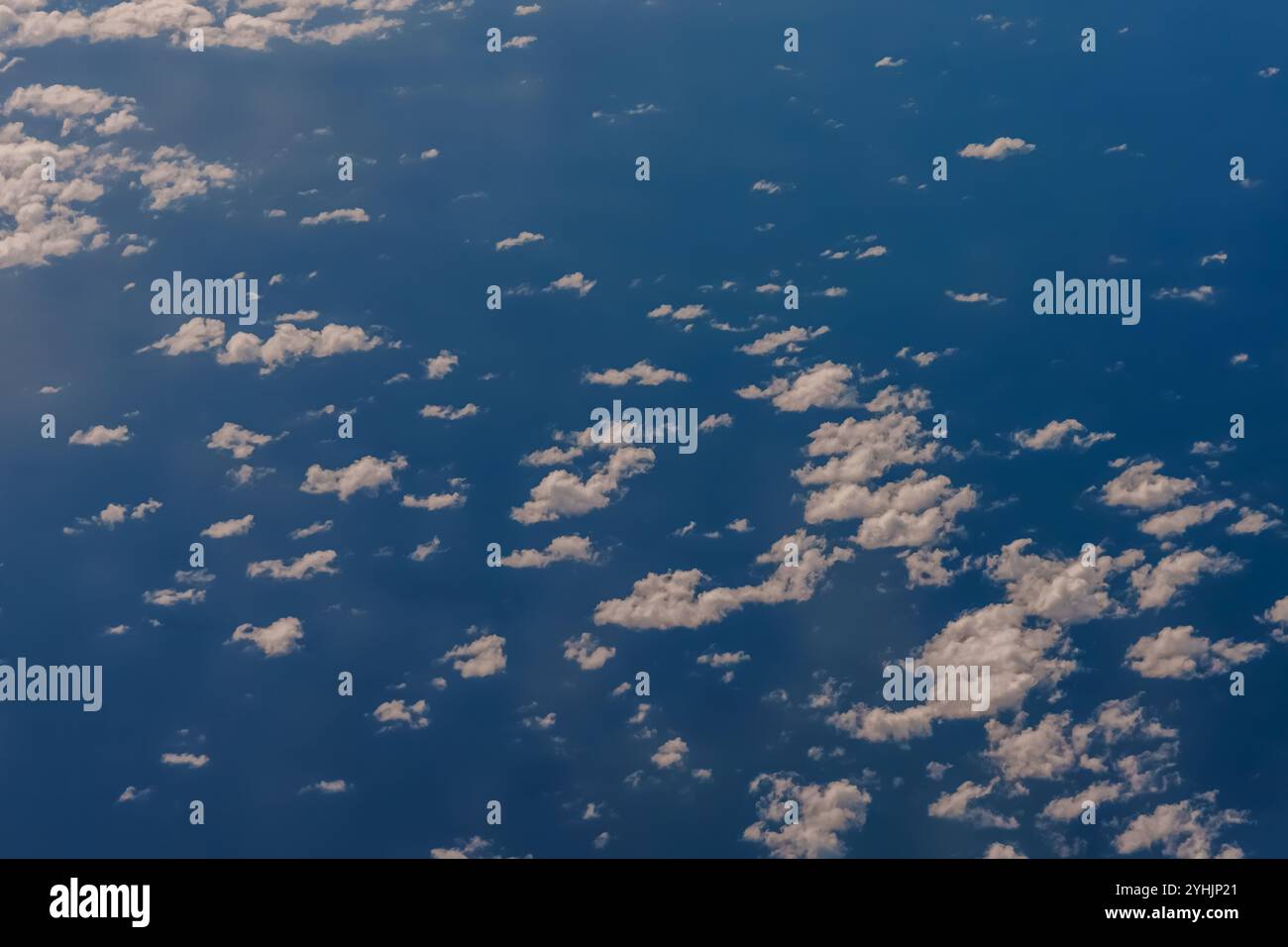 Aerial view from airplane window above green ground. View from the ...