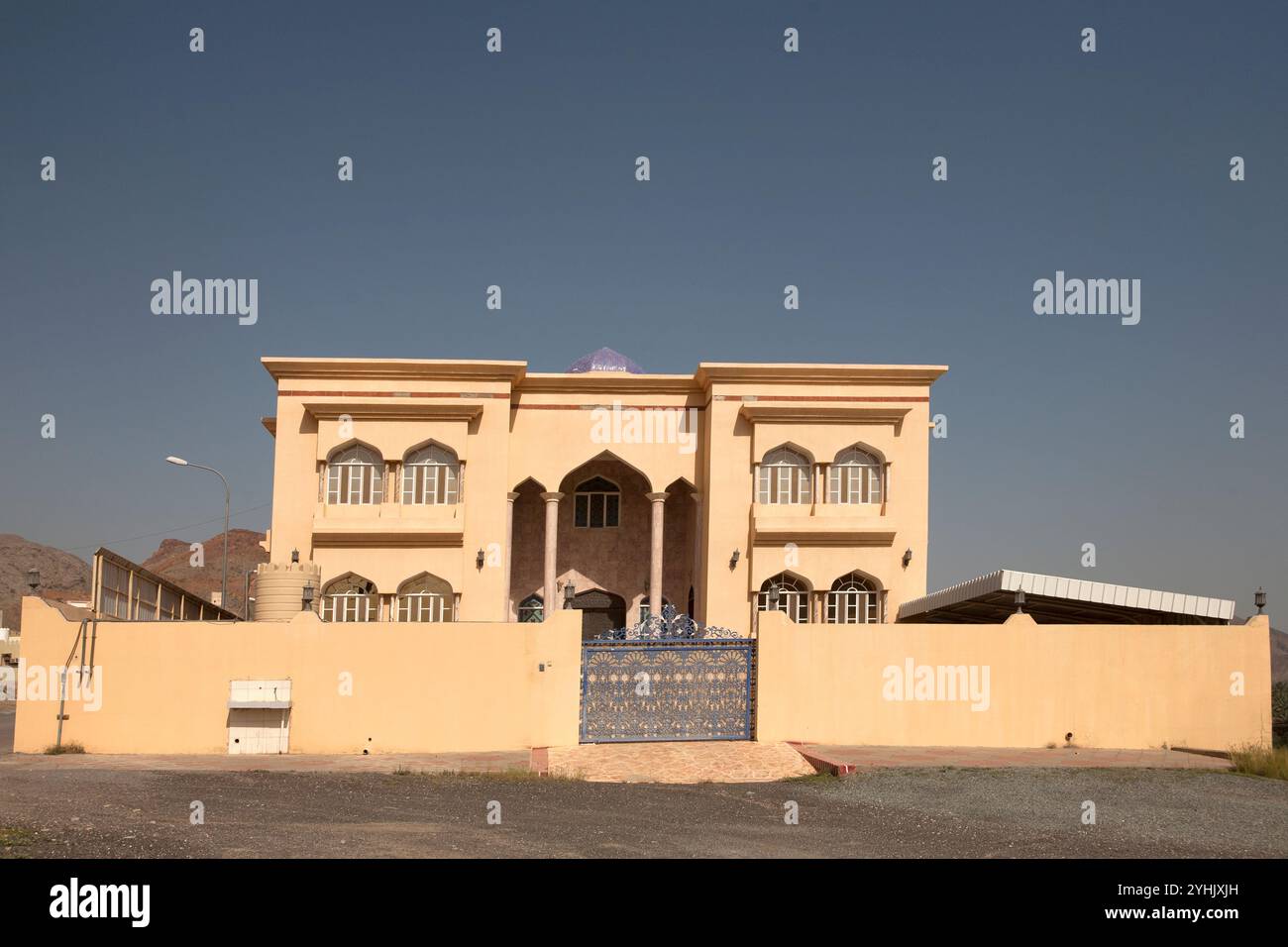 walled detached house with metal gate fanja oman middle east Stock ...