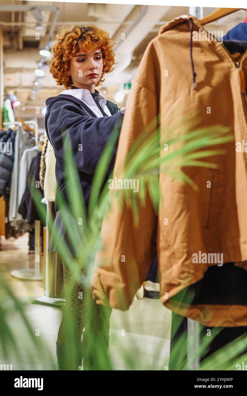 Teenager trying on clothes store hi-res stock photography and images ...