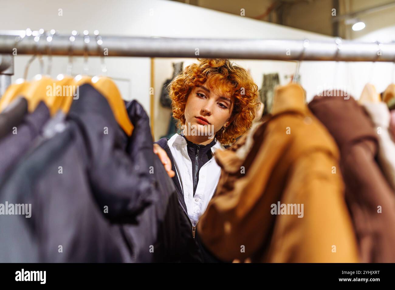 Teenager trying on clothes store hi-res stock photography and images ...