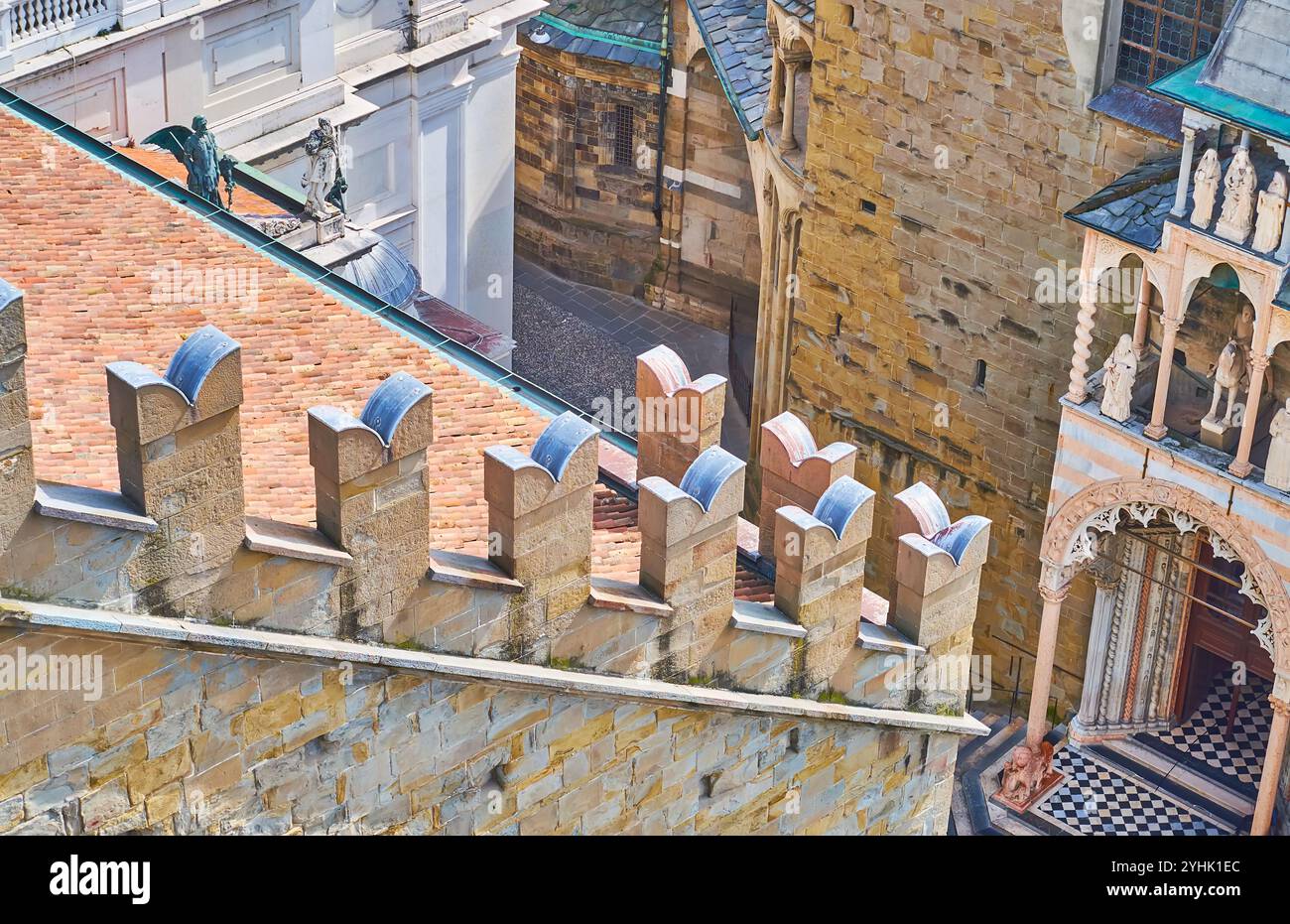 The carved stone battlements of the medieval Palazzo della Ragione ...