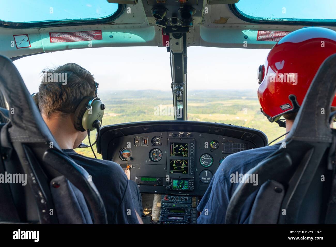 Helicopter flying over the Amazon rainforest. A preferred means of ...