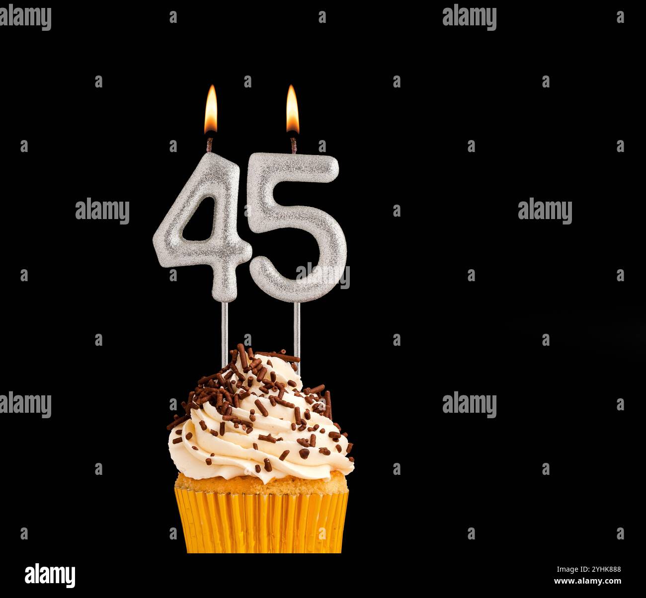Birthday cupcake on black background - Number 45 shaped candles Stock ...
