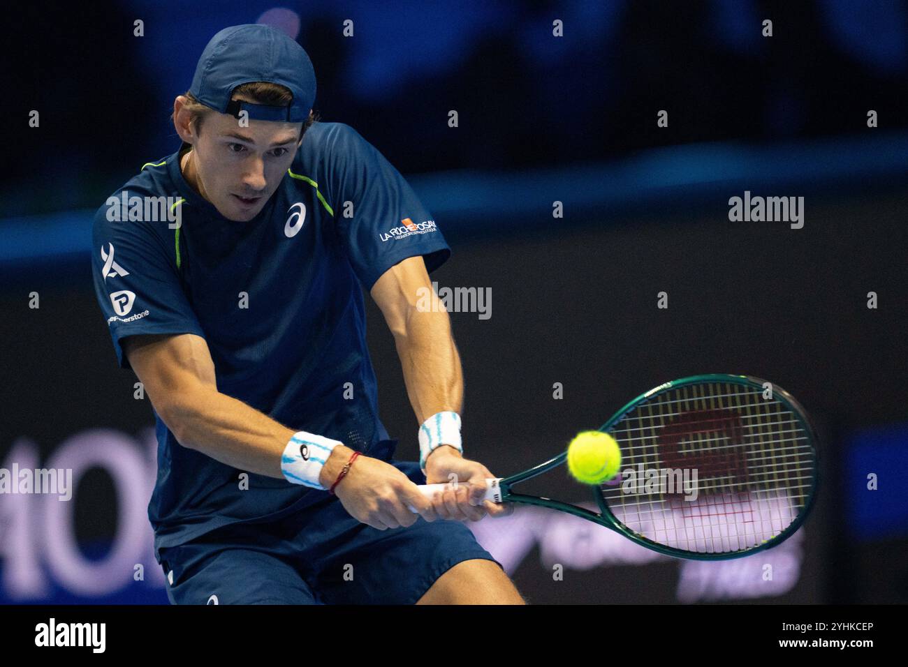 Turin, Italy. 12th Nov, 2024. Australias Alex de Minaur returns the ball to Russia's Daniil ...