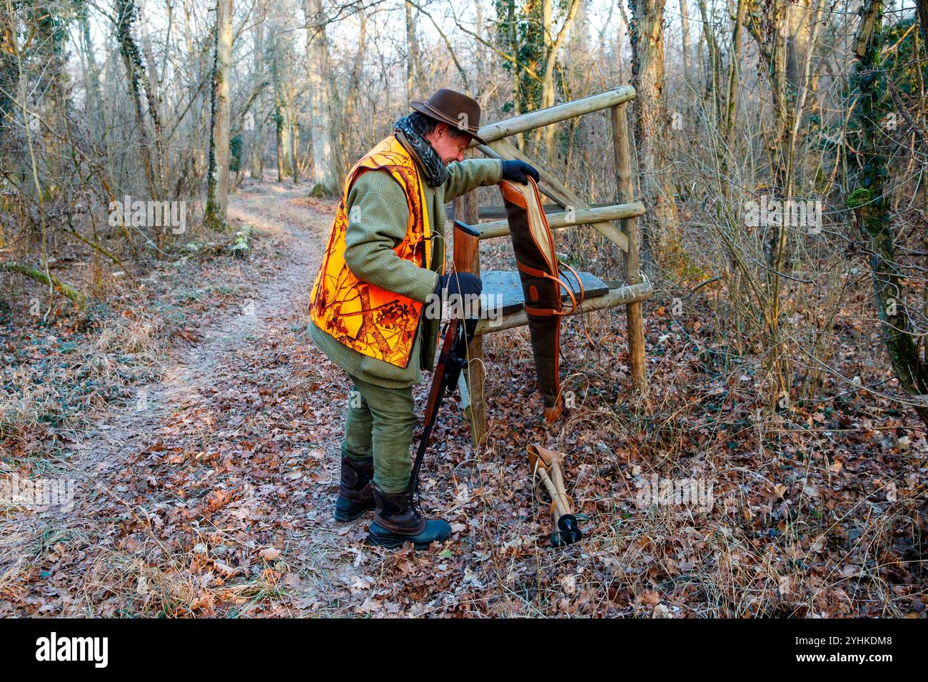 Big game hunting, a hunter joins his hunting post (a small watchtower ...