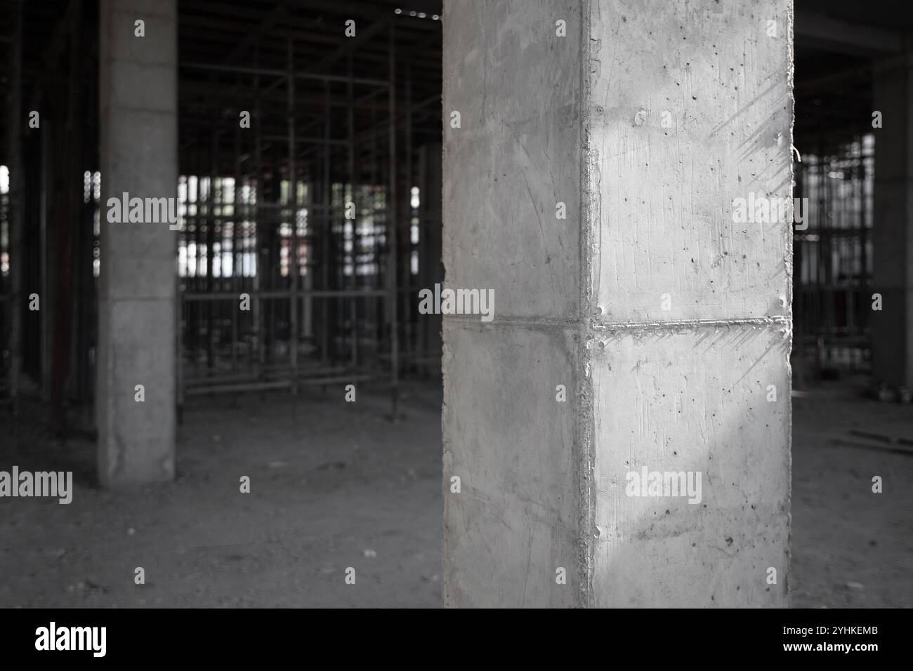 Amidst scaffolding, a fortified concrete column stands as the ...