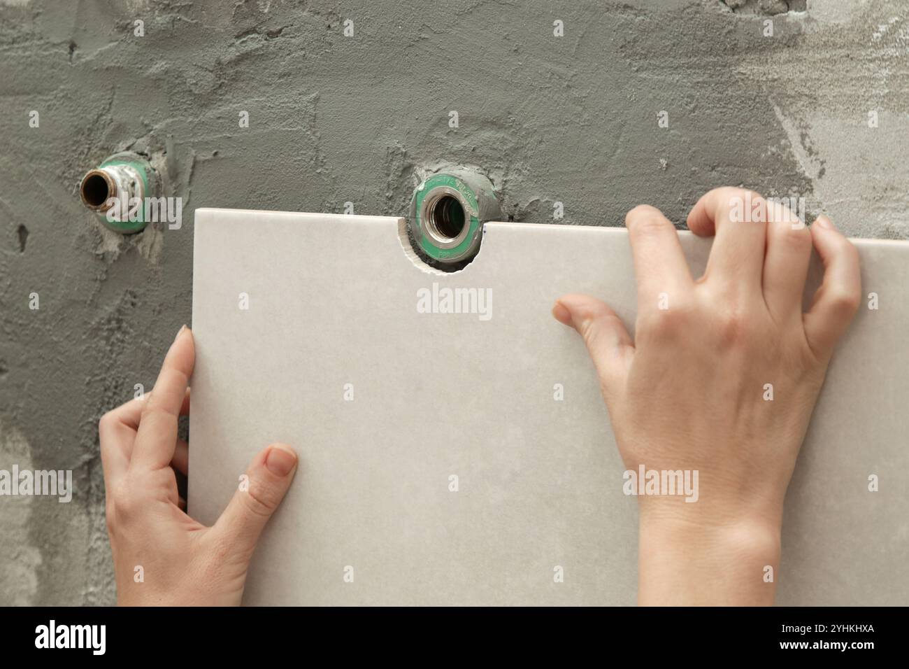 Installing tiles applying mortar wall hi-res stock photography and ...