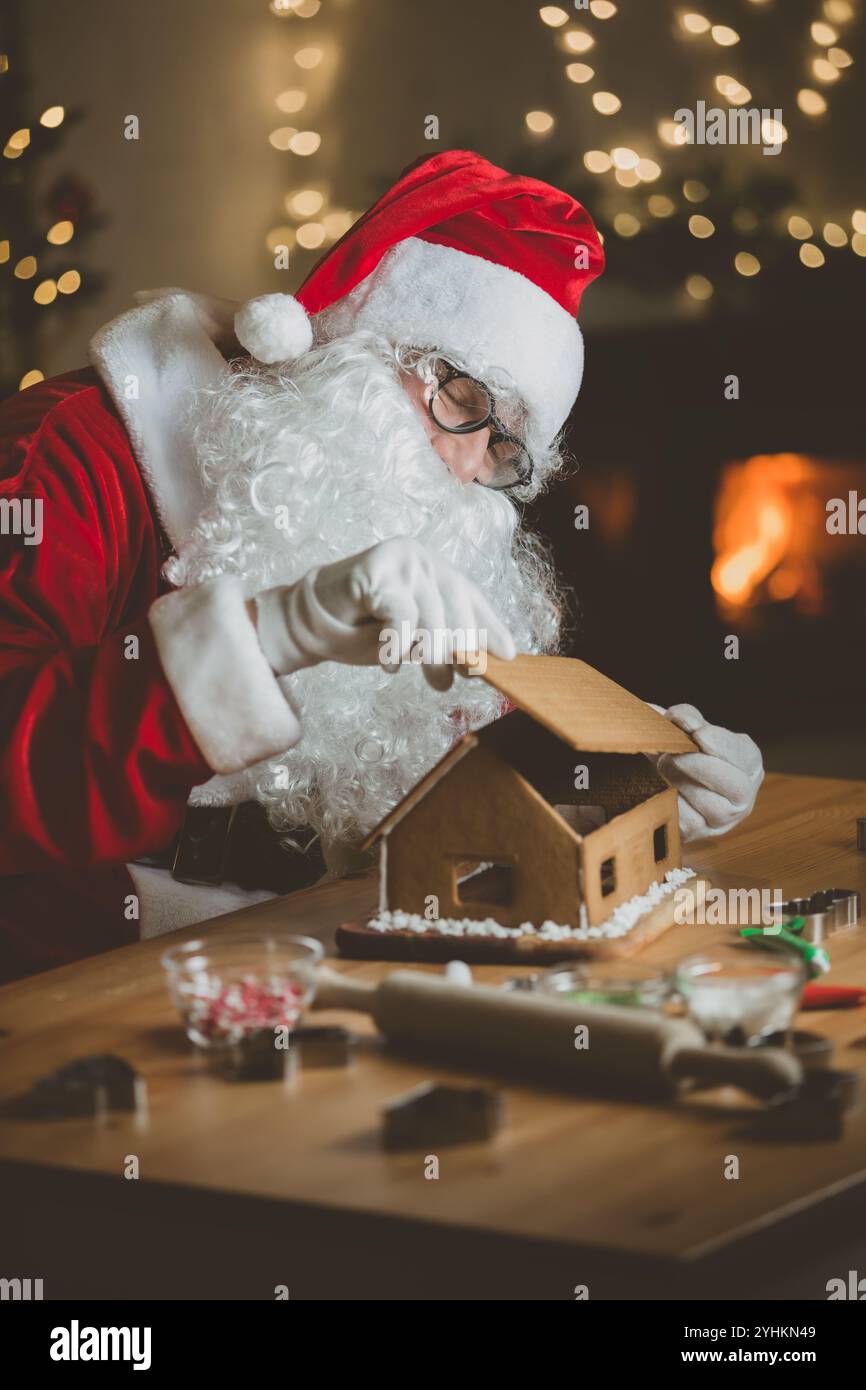 Jolly Santa Claus baking ginger bread, making ginger bread house ...