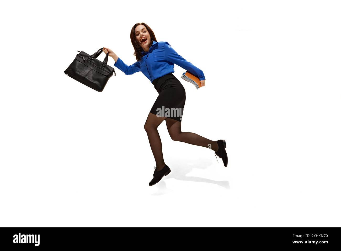 Happy, excited young woman, dressed official outfit running in motions ...