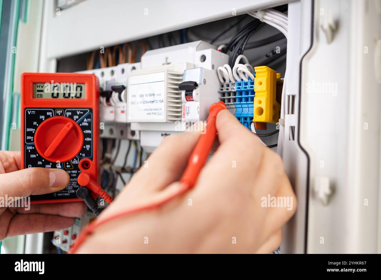 Electrical Technician Measuring Voltage with Multimeter Stock Photo - Alamy