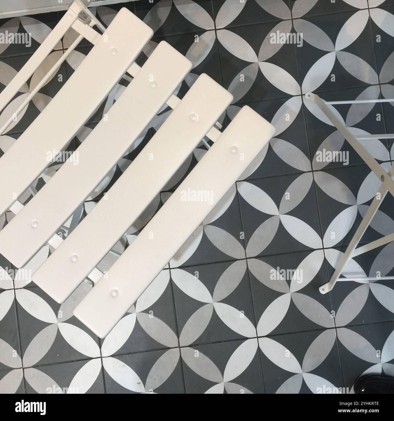 Minimalistic composition featuring a white slatted chair against ...