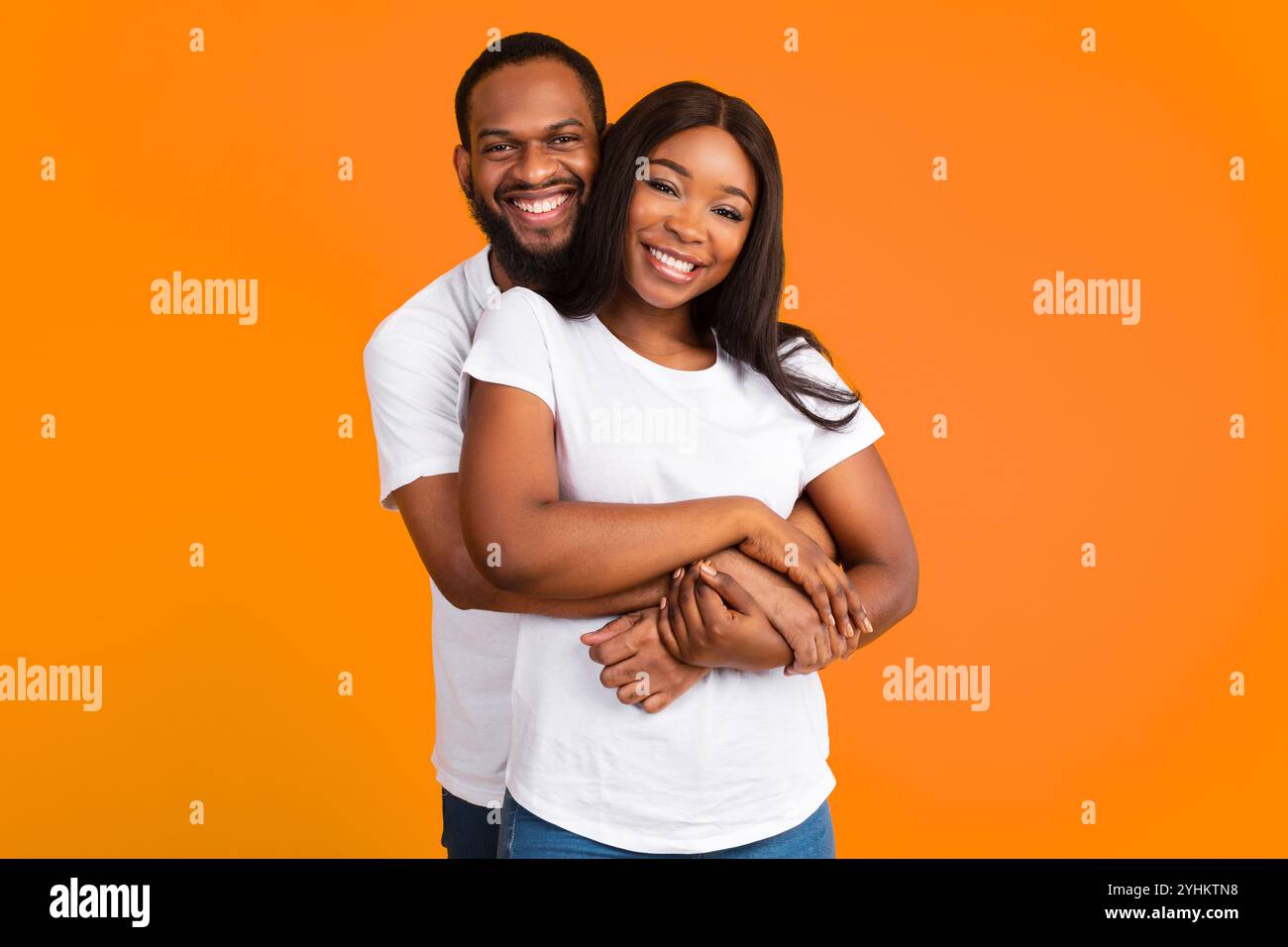 African American bearded man cuddling with his woman Stock Photo - Alamy