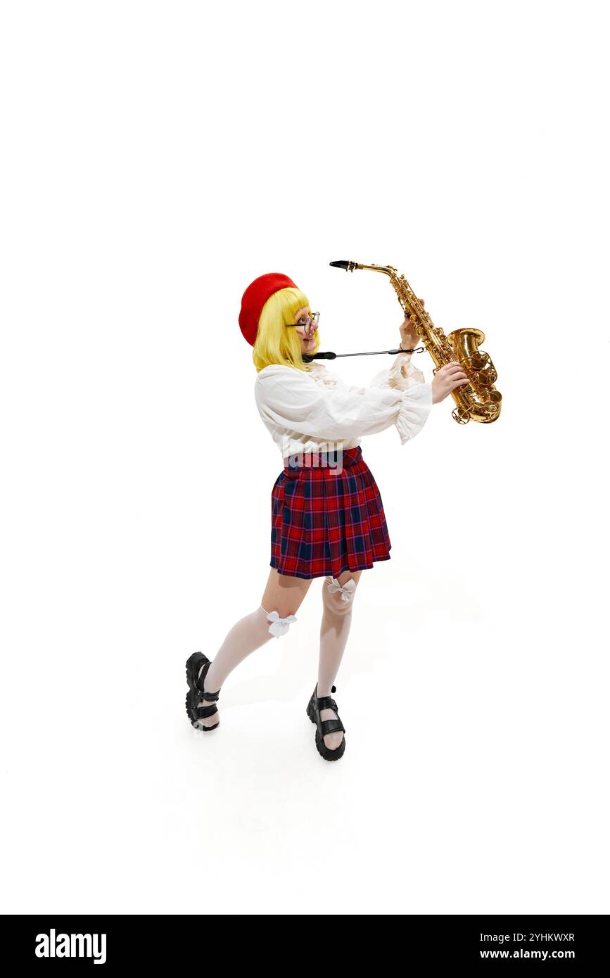 Woman with yellow wig, red beret, and plaid skirt playing saxophone ...
