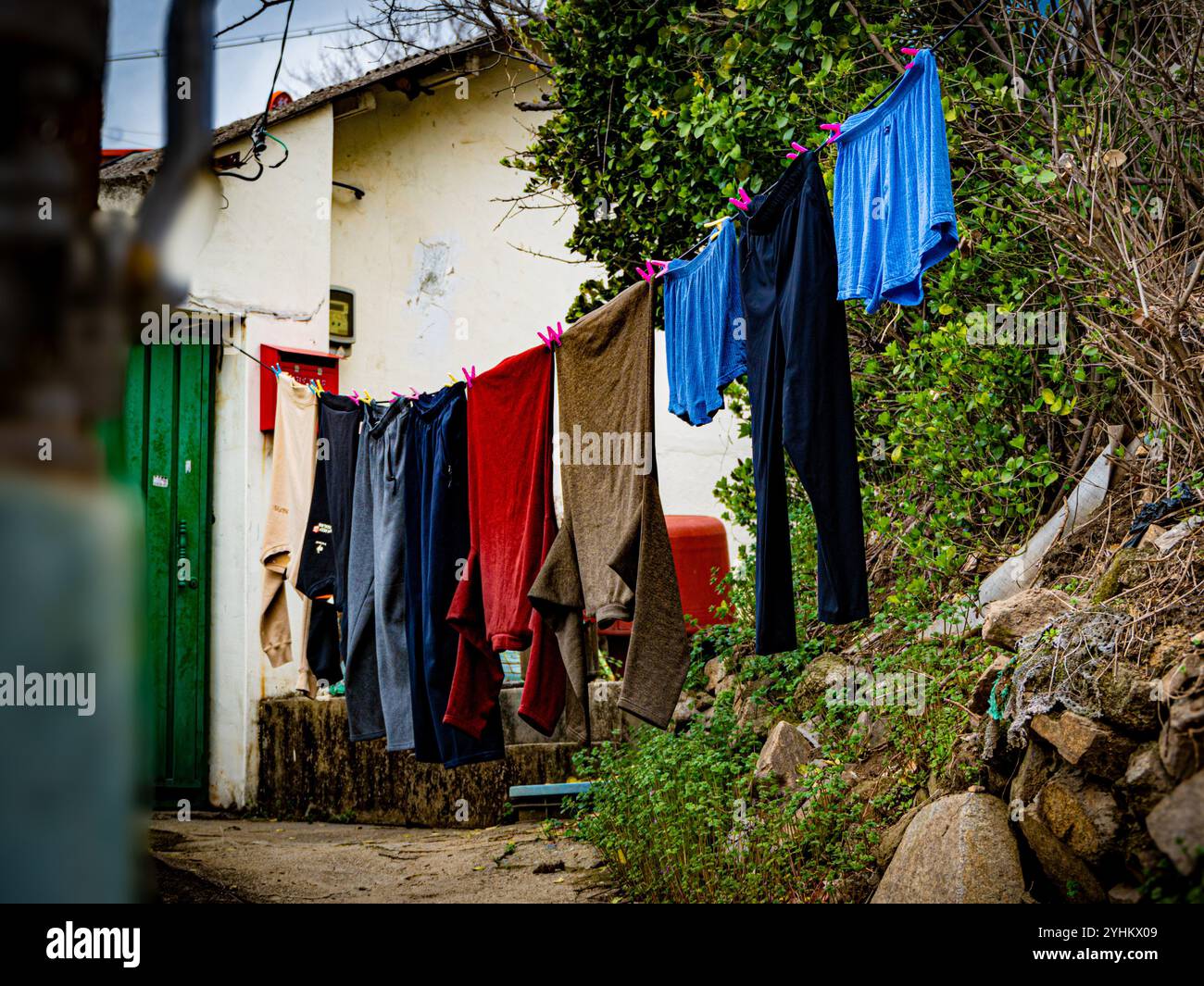 Hanging Laundry on Clothesline in Rustic Yard Stock Photo - Alamy